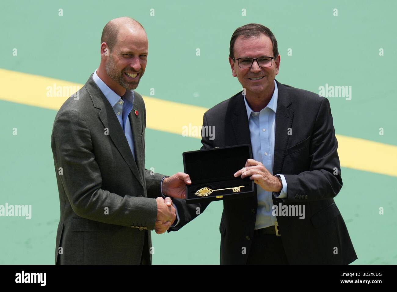 Britain's Prince William, left, receives the key to the city from Rio ...