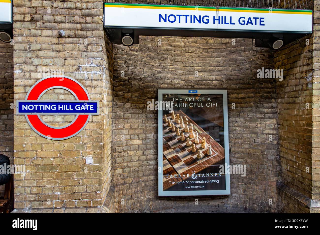 An advert on the wall on the platform at Notting Hill gate London ...