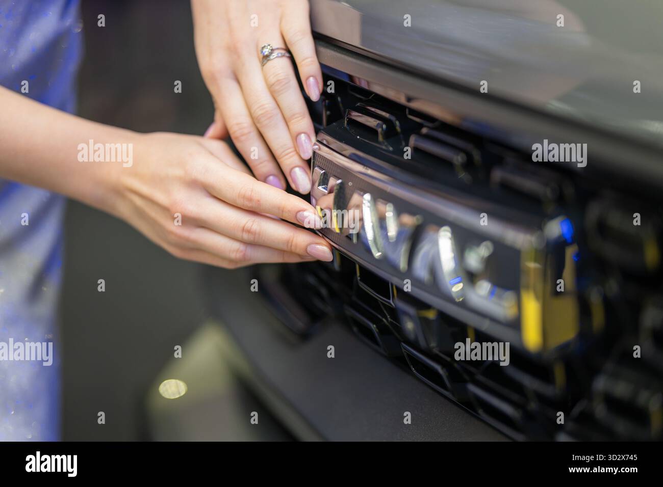 MINSK, BELARUS - OCTOBER 15, 2025: A woman's hands are shown touching ...