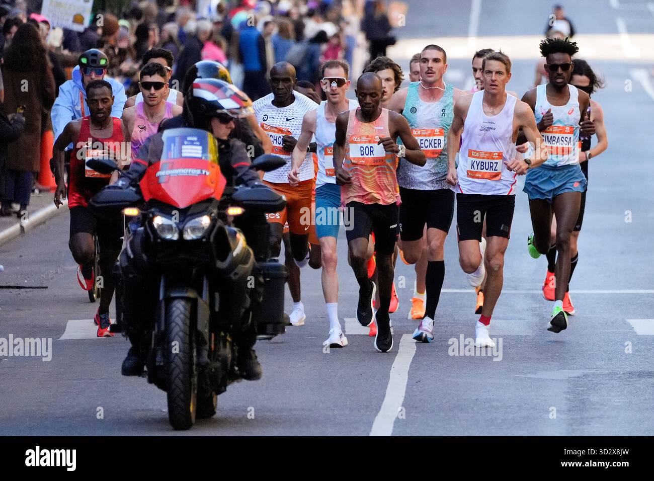 Matthias Kyburz, of Switzerland, second from right, keeps pace with the ...