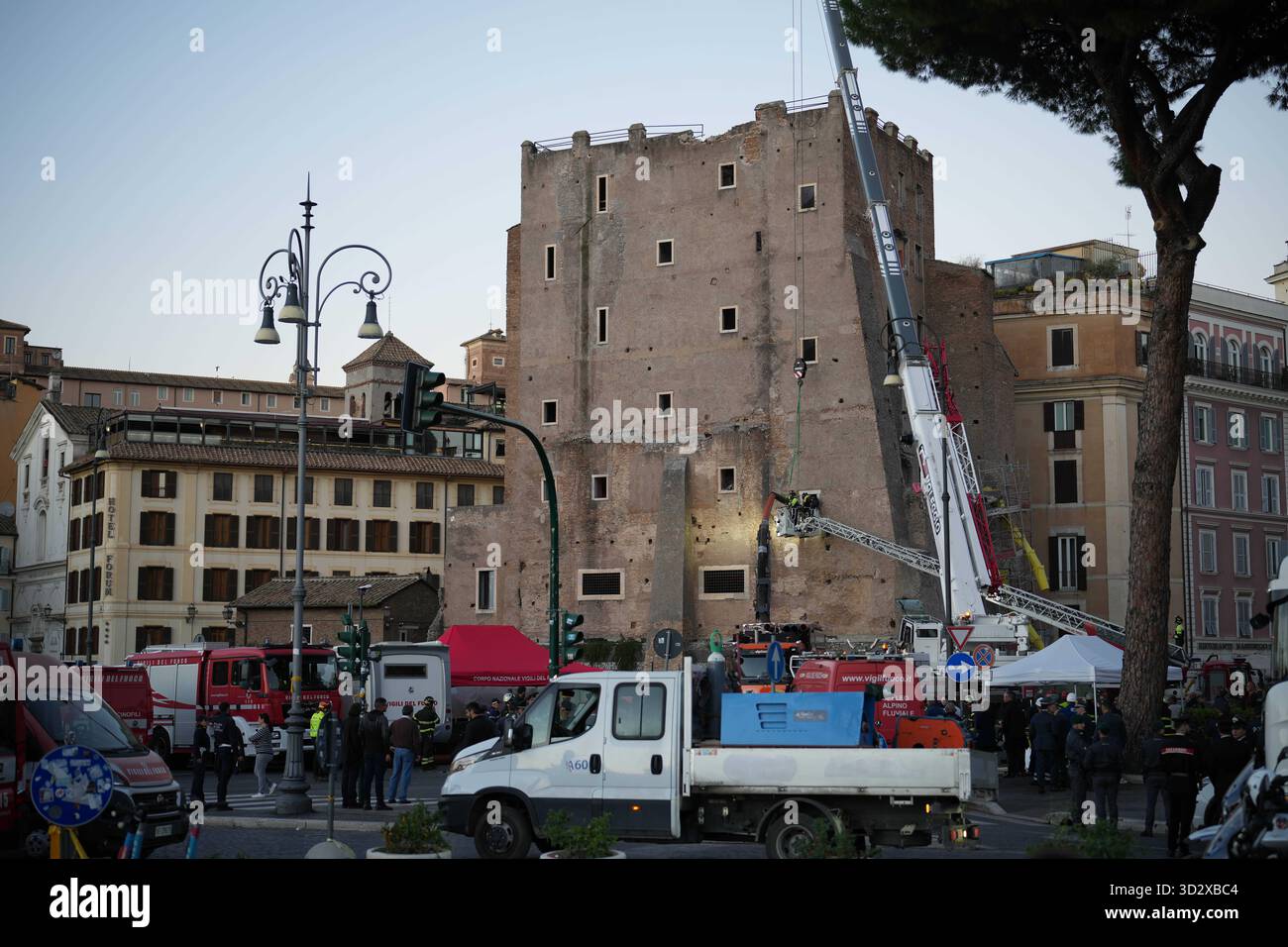 Firefighters work on a medieval tower Torre dei Conti near the Roman ...