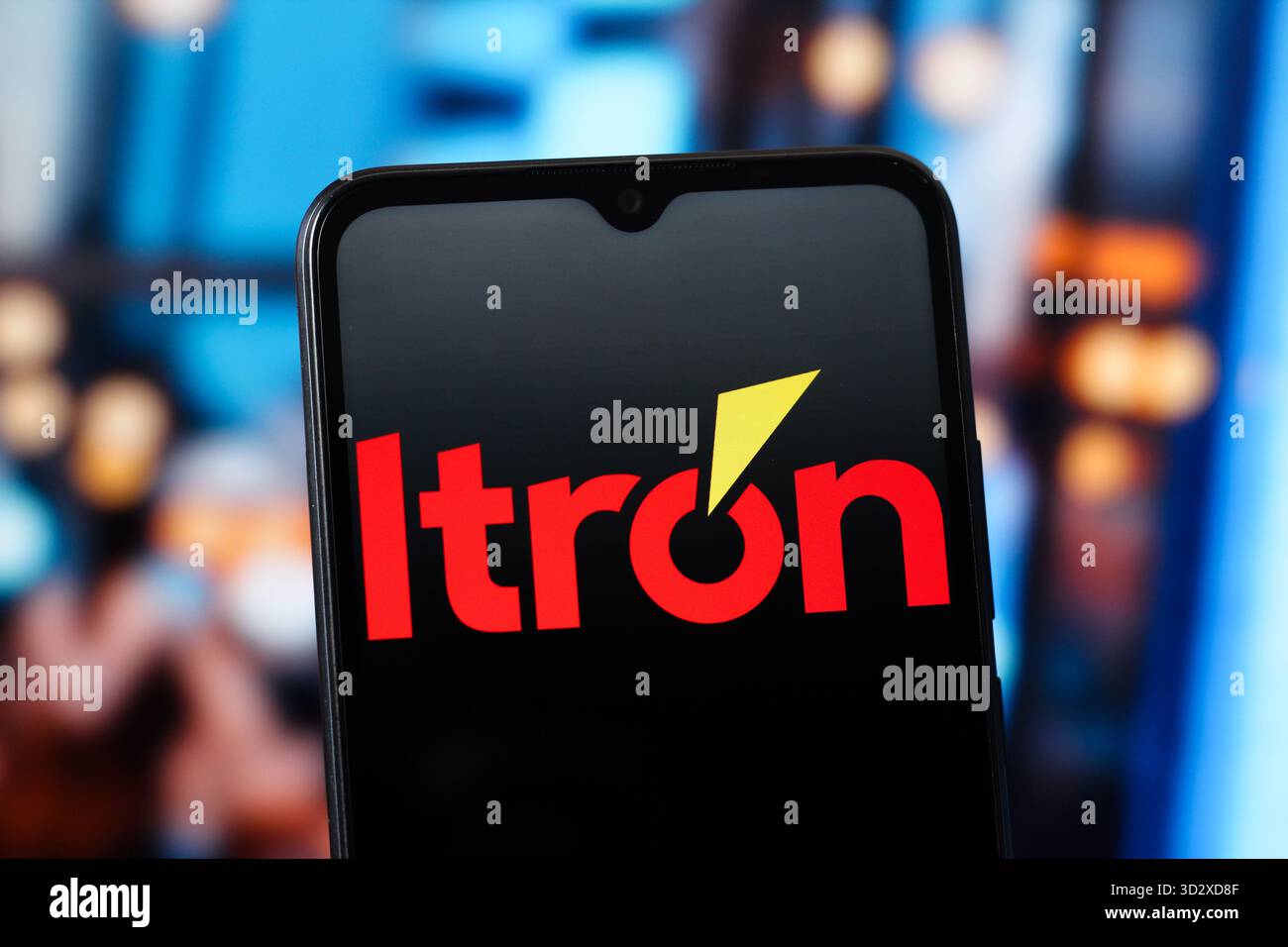 In this photo illustration, the Itron logo is seen displayed on a ...