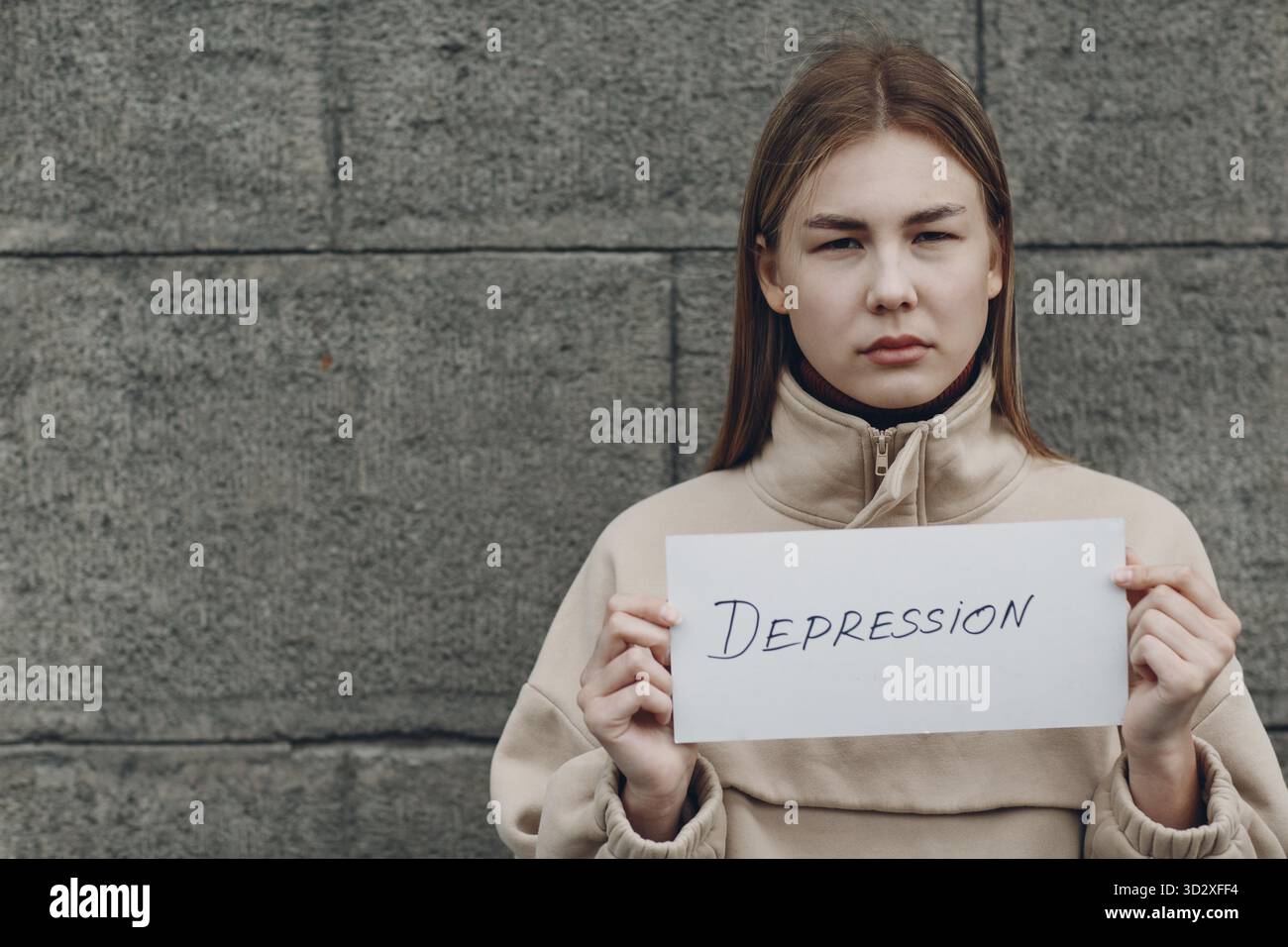 Girl holds in hand sheet of paper with word Depression Stock Photo - Alamy