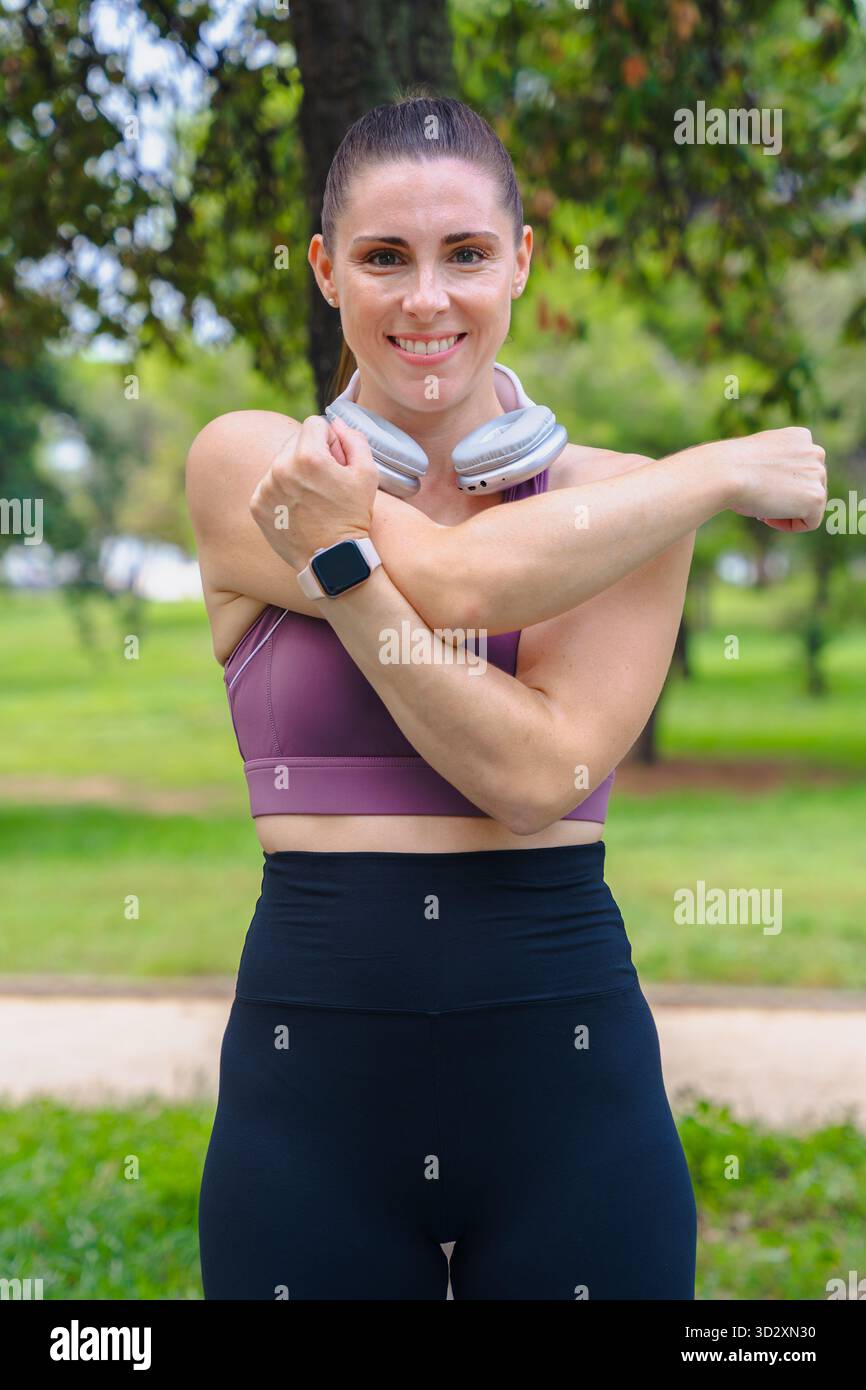 Woman stretching arm across hi-res stock photography and images - Alamy