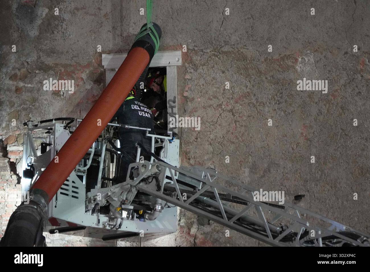 Firefighters work on a medieval tower Torre dei Conti near the Roman ...
