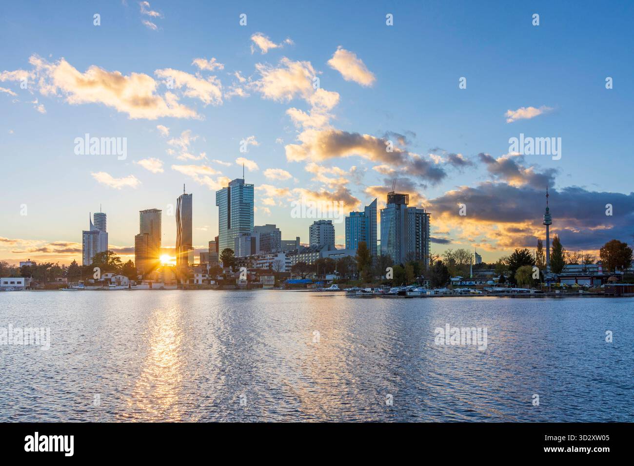river Alte Donau Old Danube, Donaucity, tower Donauturm, sunset Vienna ...
