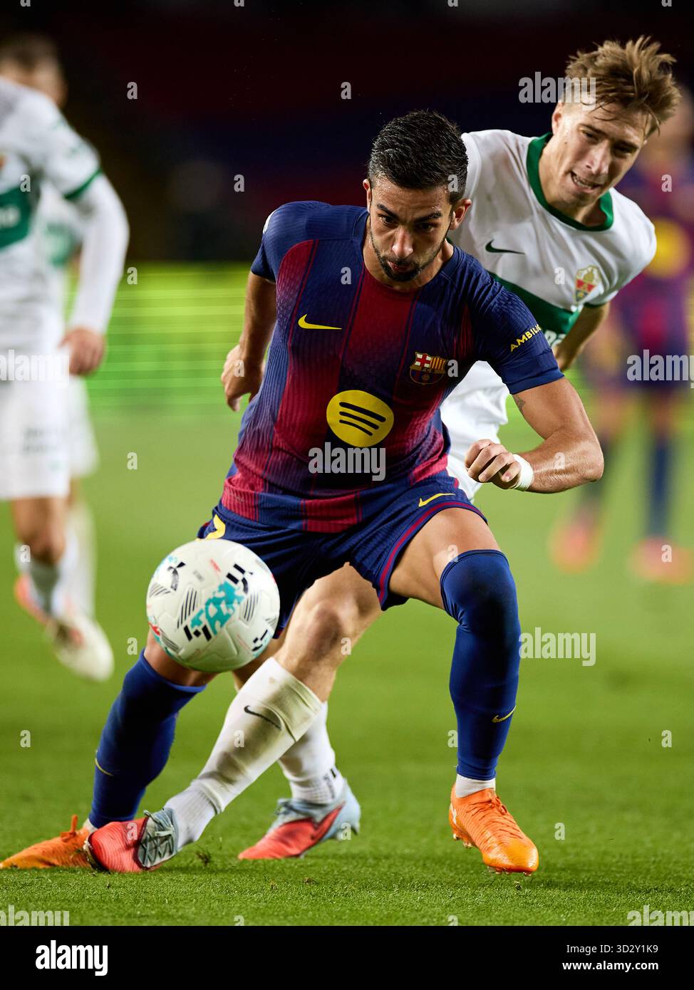 Ferran Torres of FC Barcelona in action with David Affengruber of Elche ...