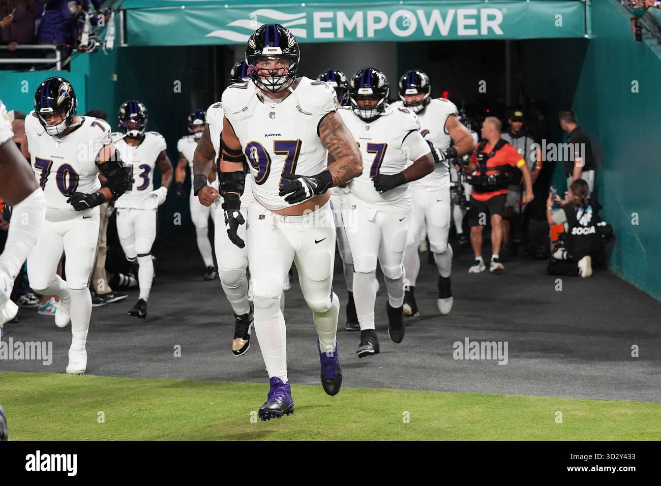 Baltimore Ravens defensive end Brent Urban (97) runs onto the field ...