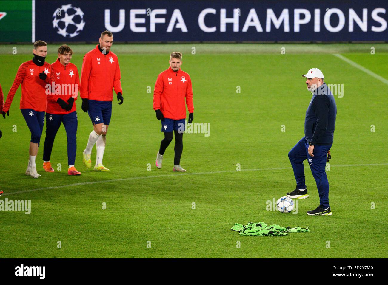 Slavia coach Jindrich Trpisovsky, right, attends the training session ...