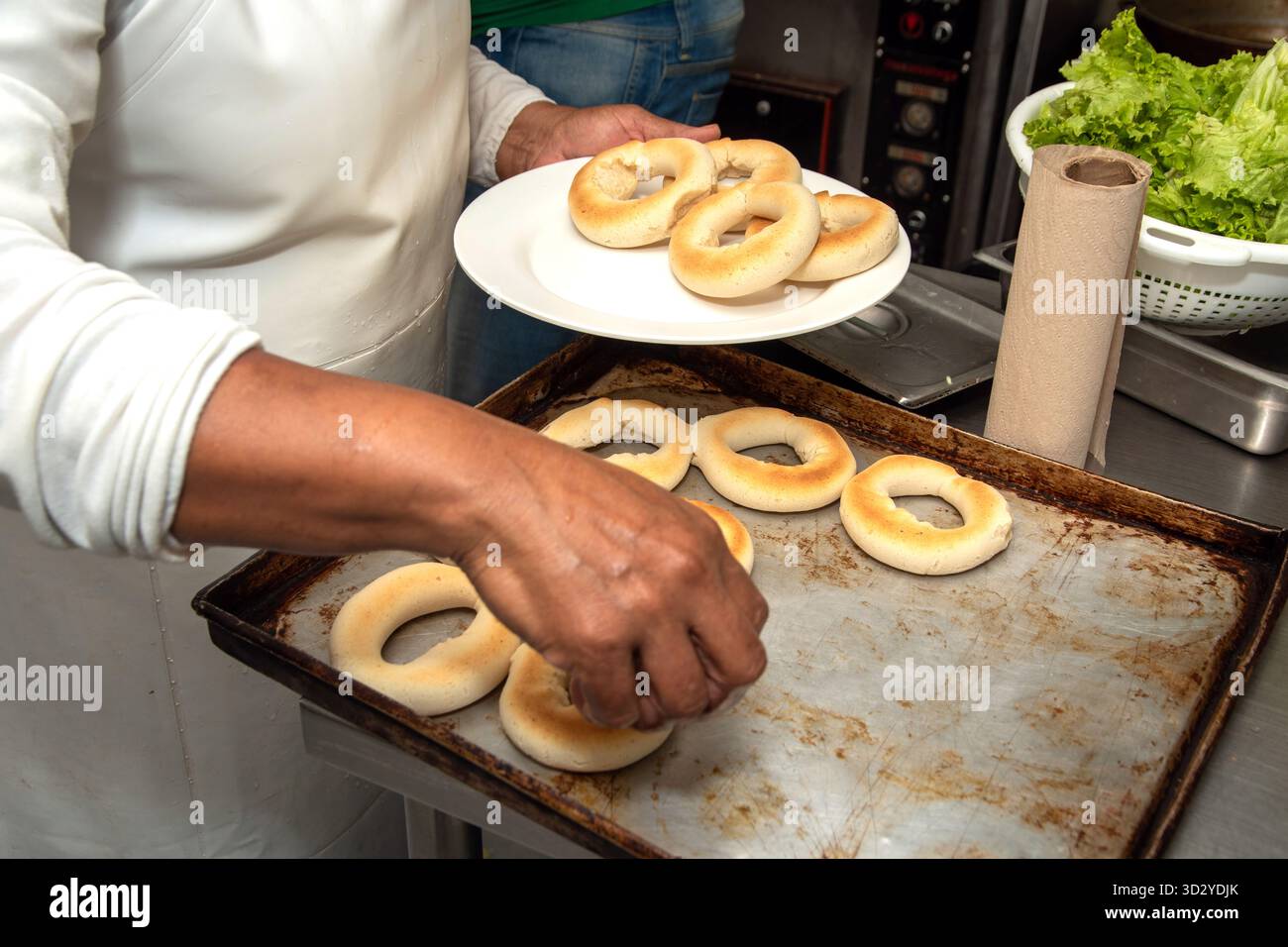 Colombian woman serving pandebono, traditional artisanal cheese bread ...