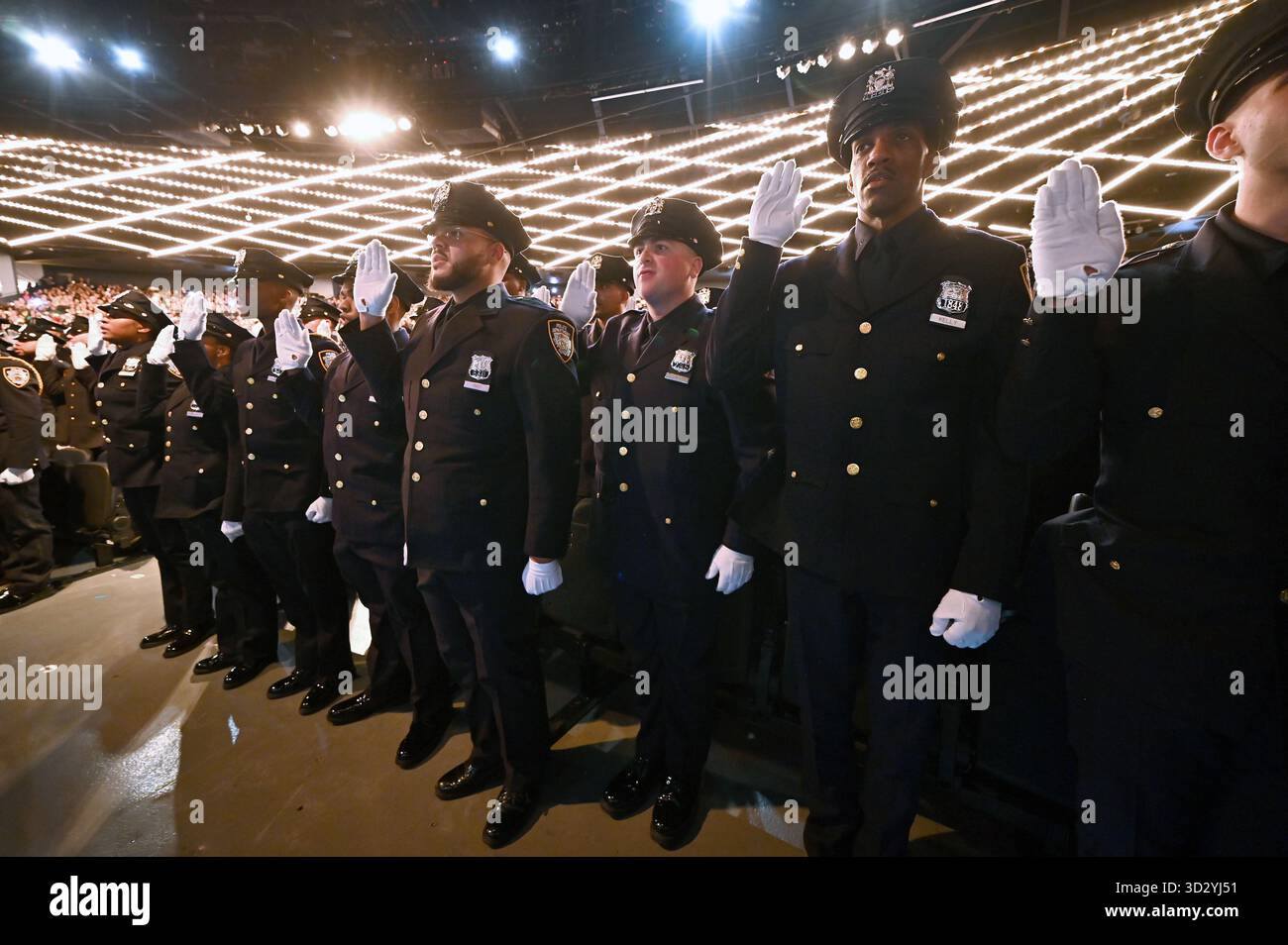 New York, USA. 03rd Nov, 2025. Graduating NYPD cadets take the oath as ...