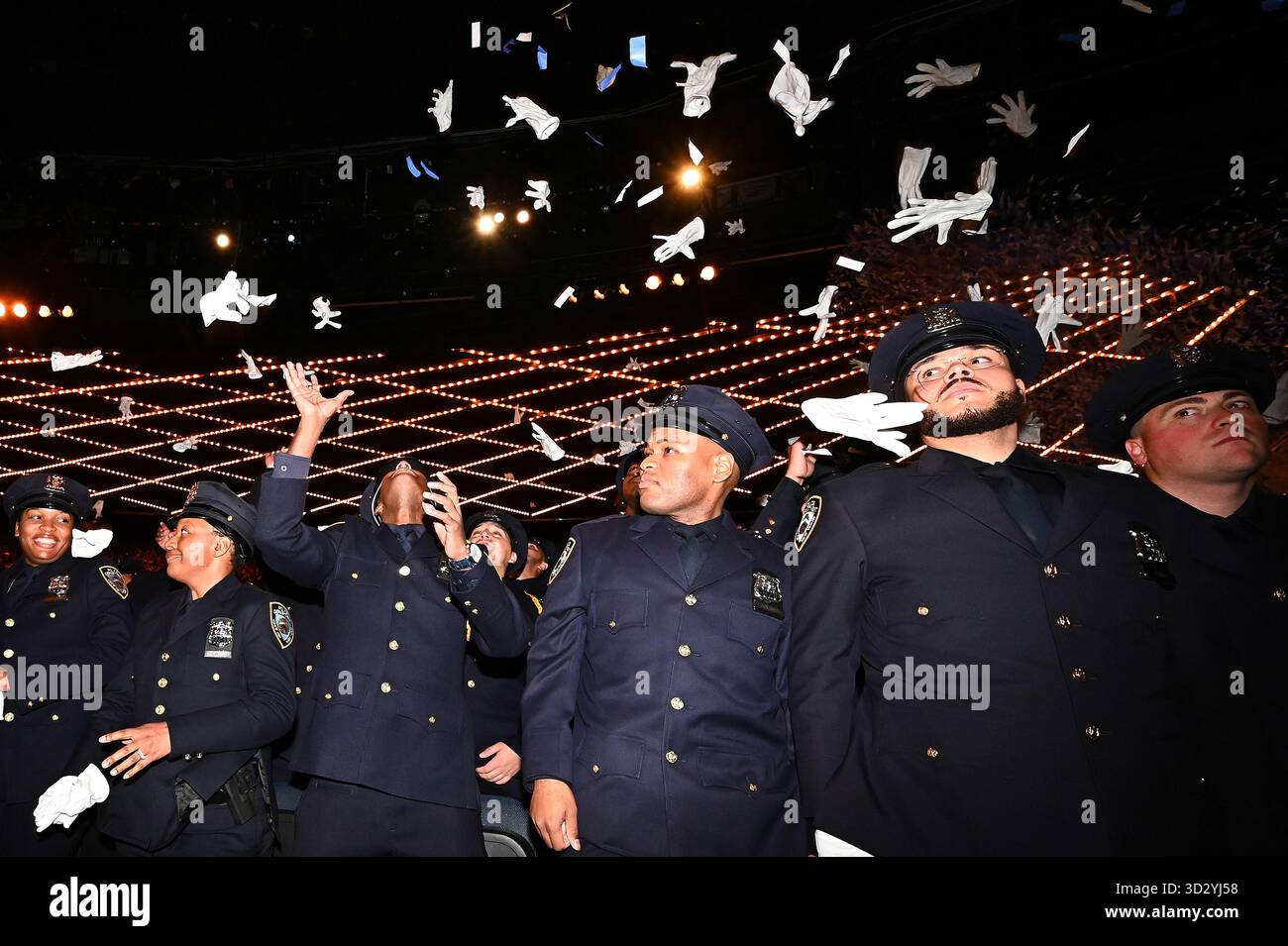 White gloves are thrown in the air as newly sworn in NYPD officers ...