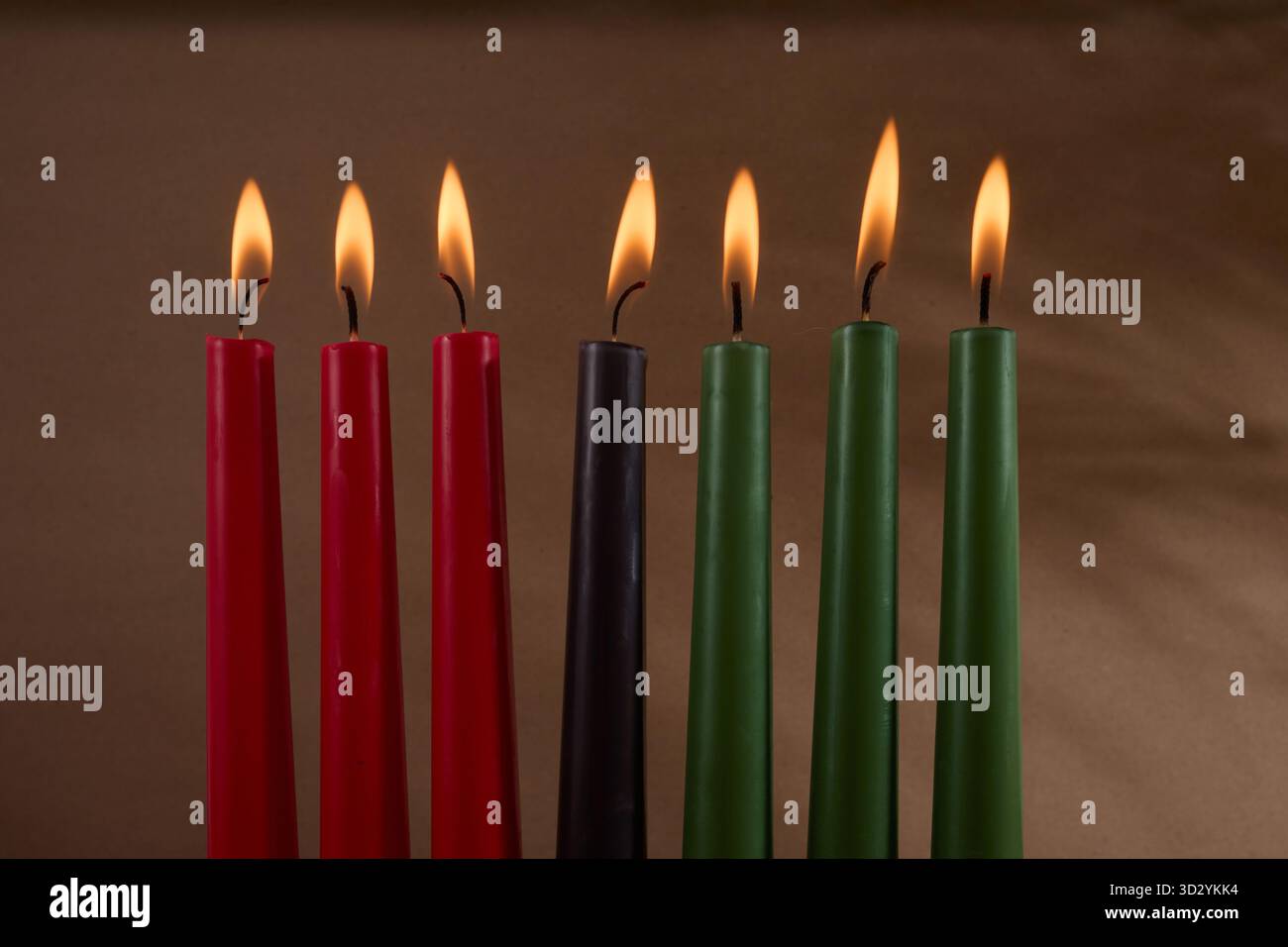 African American Kwanzaa holiday concept with traditional lit candles ...