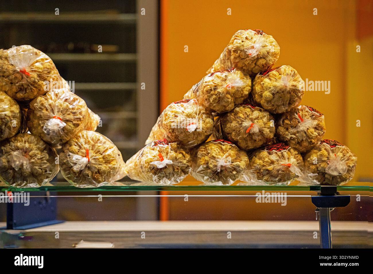 Packaged popcorn with various flavors at a street fair Stock Photo - Alamy