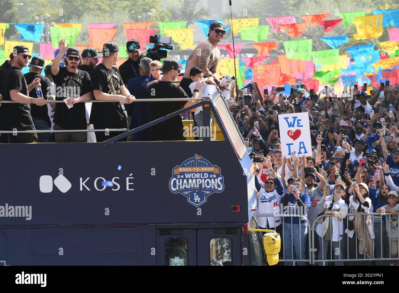 Los Angeles Dodgers players, family and staff ride on top of double ...