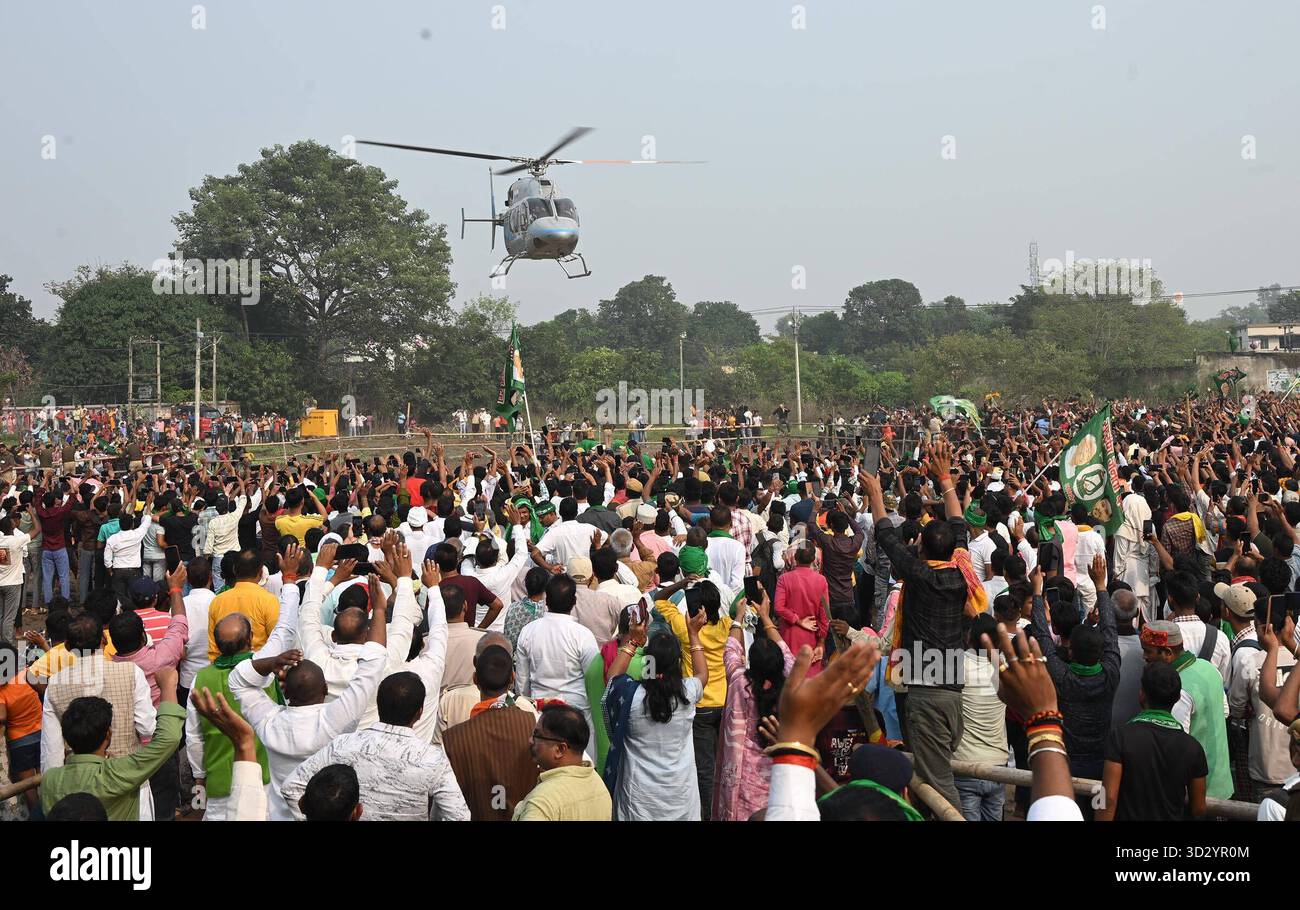 PATNA, INDIA - NOVEMBER 3: RJD workers looking helicopter of RJD leader ...