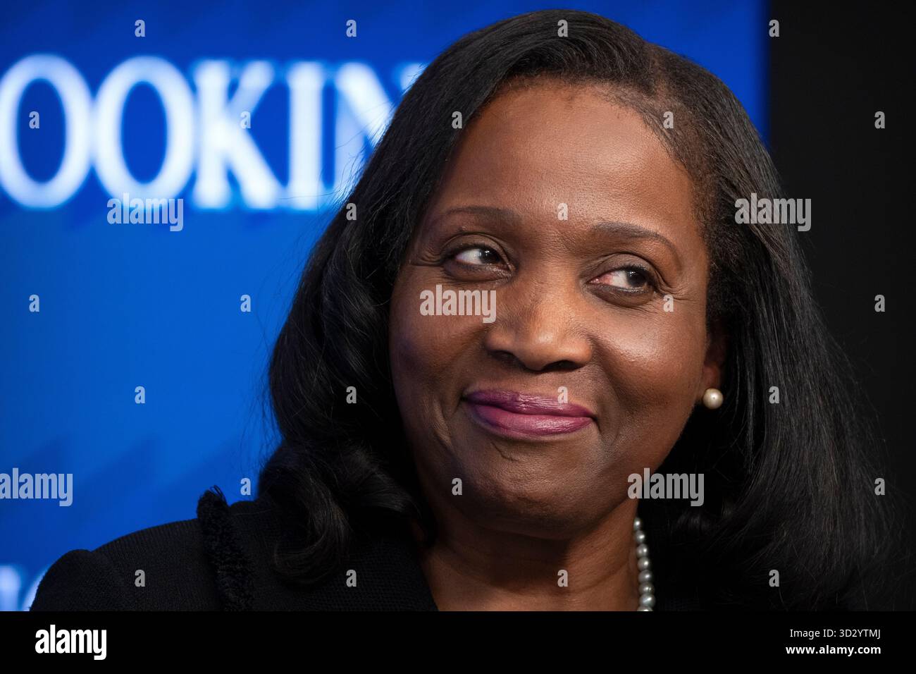 Lisa Cook, a Federal Reserve Board of Governors member, reacts during ...