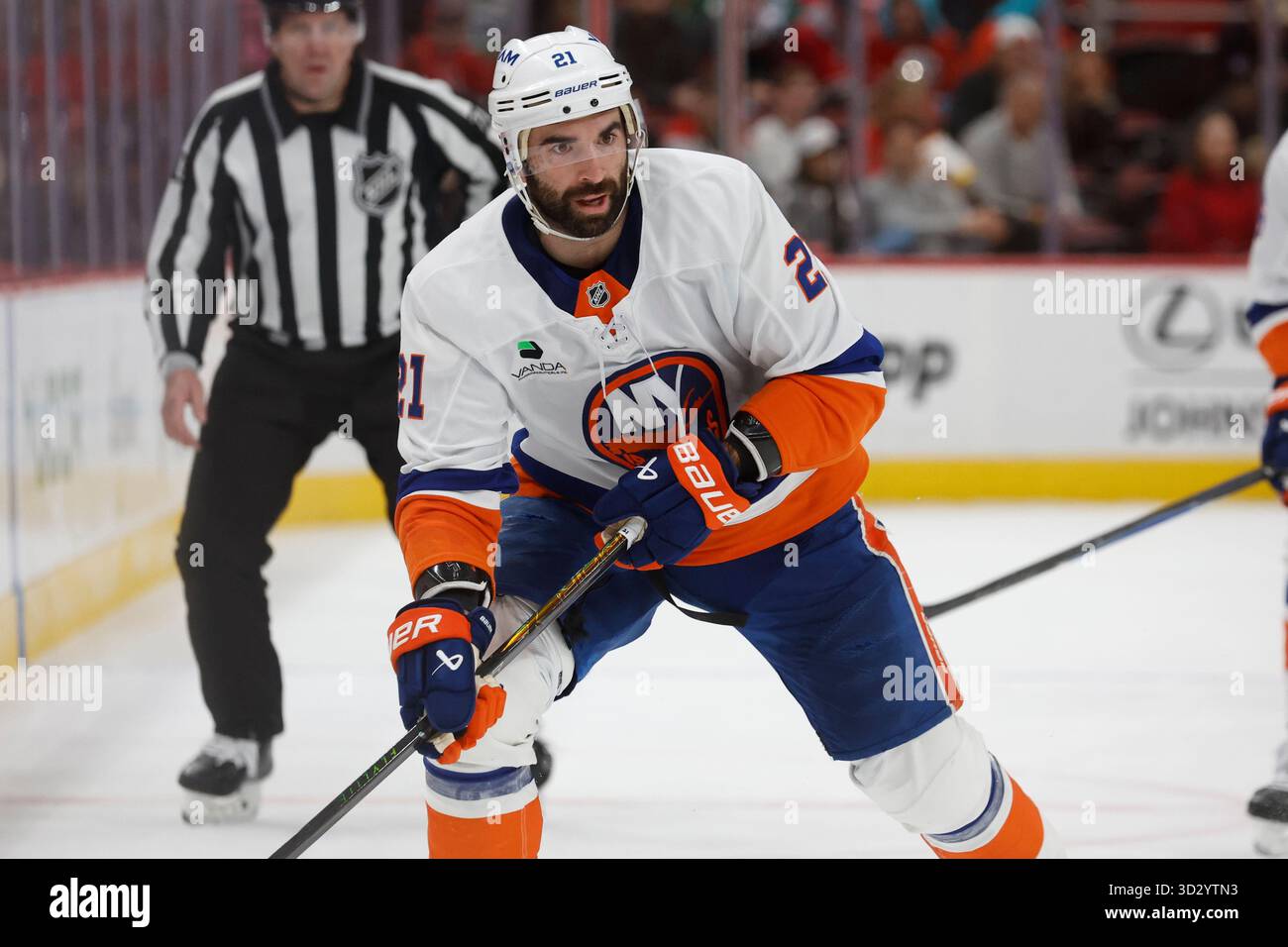 New York Islanders' Kyle Palmieri (21) controls the puck against the Carolina Hurricanes during ...