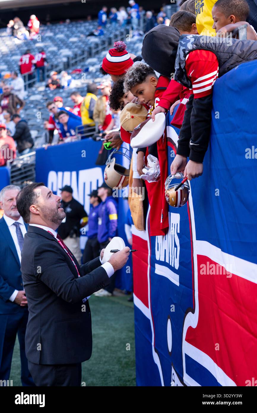 San Francisco 49ers CEO Jed York, left, signs autographs for fans prior ...