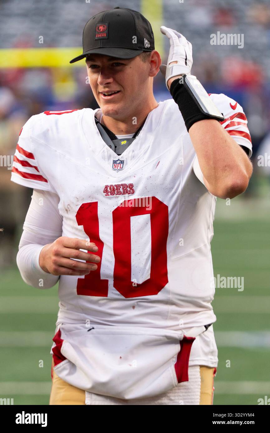 San Francisco 49ers quarterback Mac Jones (10) heads off the field ...