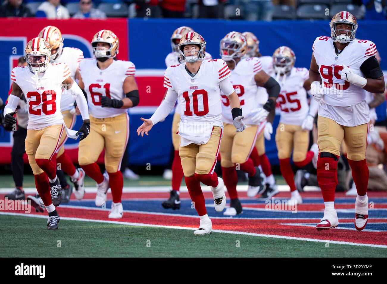 San Francisco 49ers quarterback Mac Jones (10) comes out with his team ...