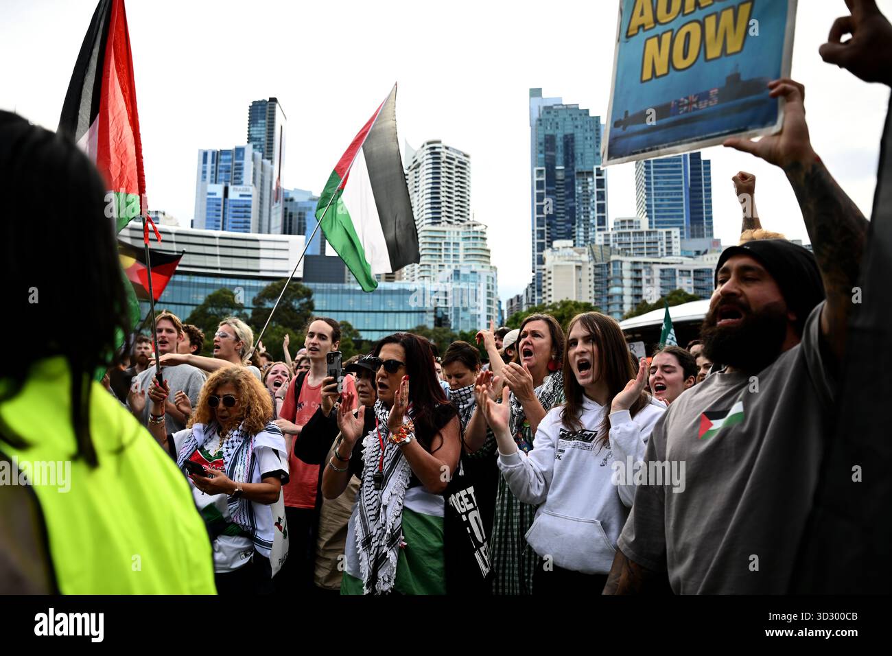 Protesters hold placards during and attempted blockade by the Palestine ...