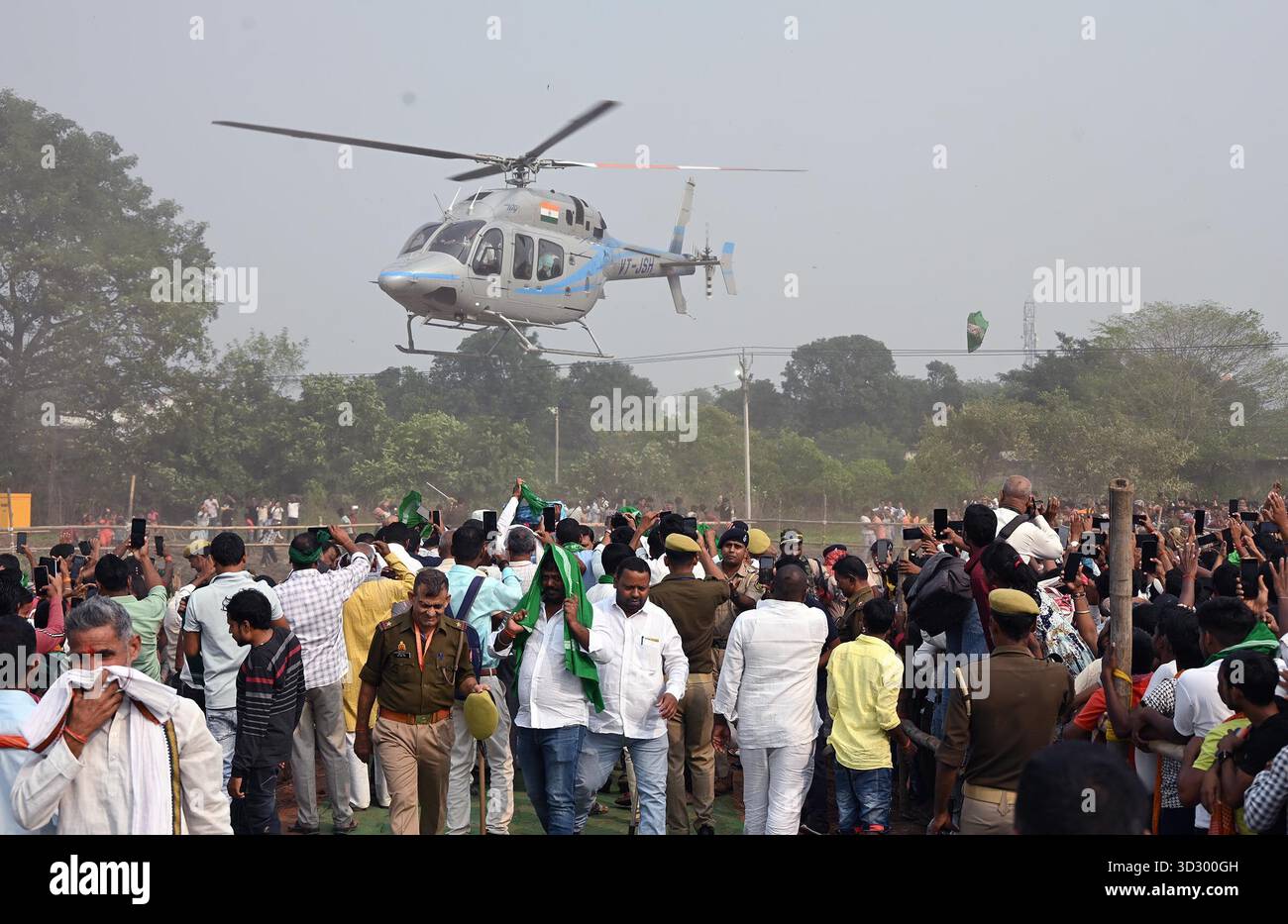 PATNA, INDIA - NOVEMBER 3: RJD workers looking helicopter of RJD leader ...