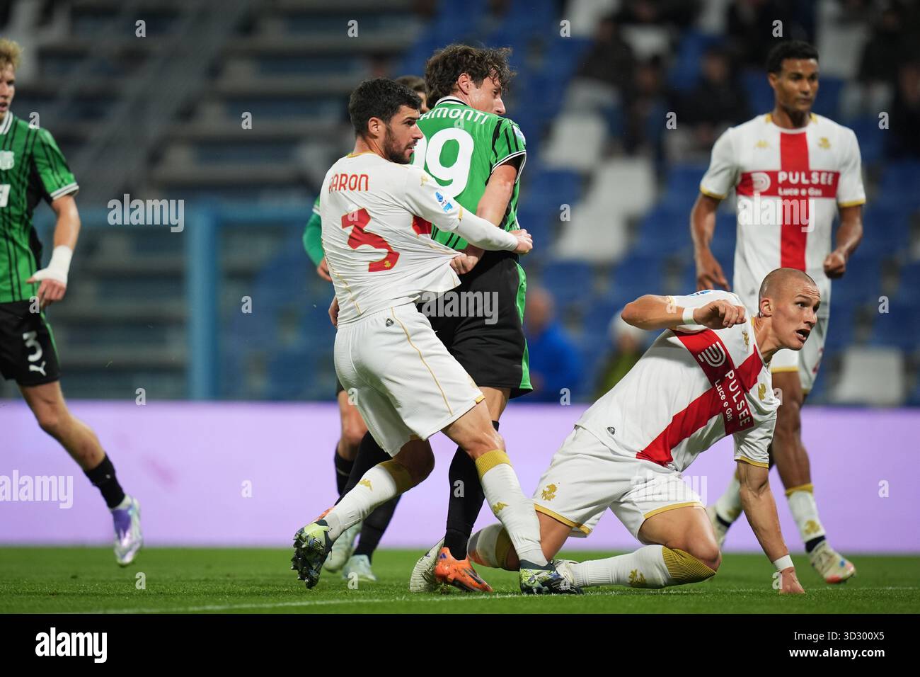 SassuoloÕs Andrea Pinamonti fights for the ball with Genoa's Aaron ...
