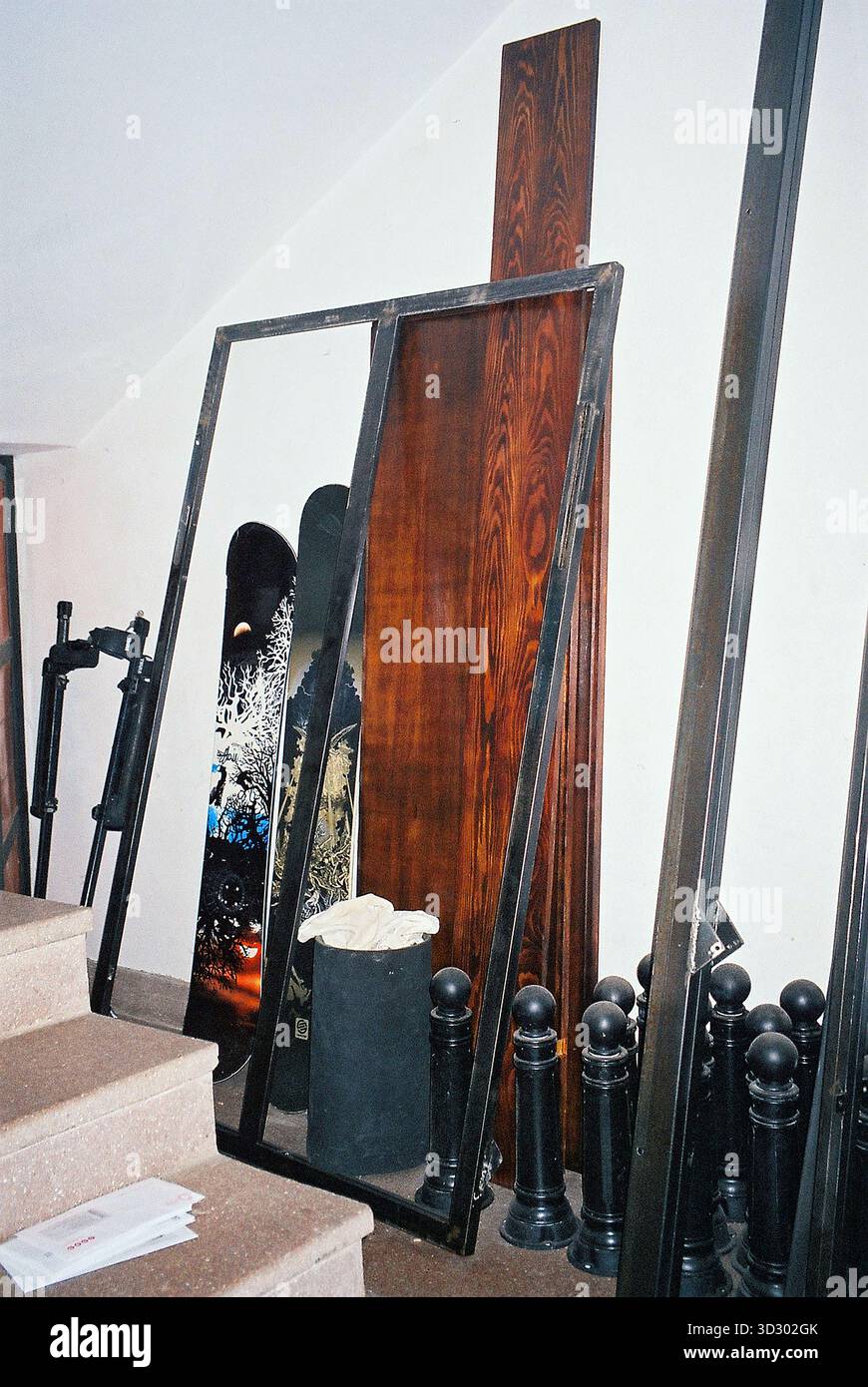 Metal and wooden parts leaning against a wall, ready for assembly ...