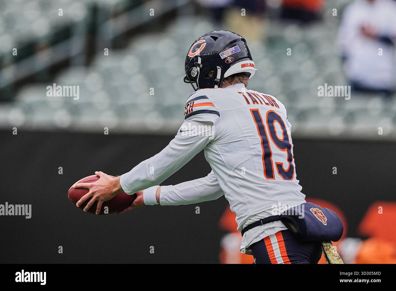 Chicago Bears punter Tory Taylor (19) warms up before an NFL football ...