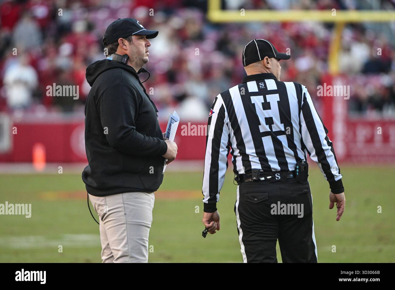 Mississippi State coach Jeff Lebby talks to the official as they play ...