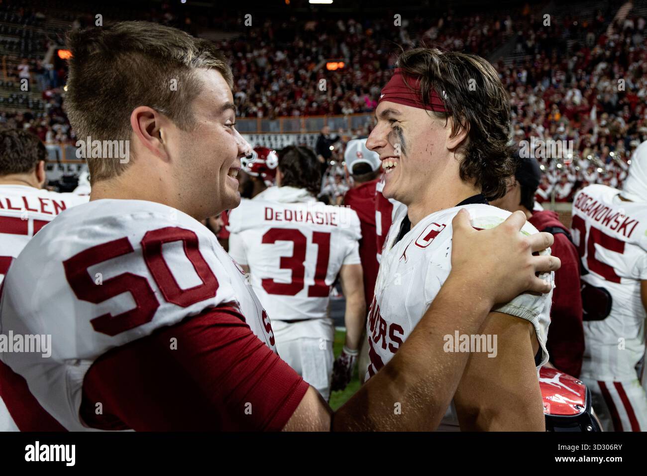 Oklahoma quarterback John Mateer (10) celebrates with long snapper Seth ...