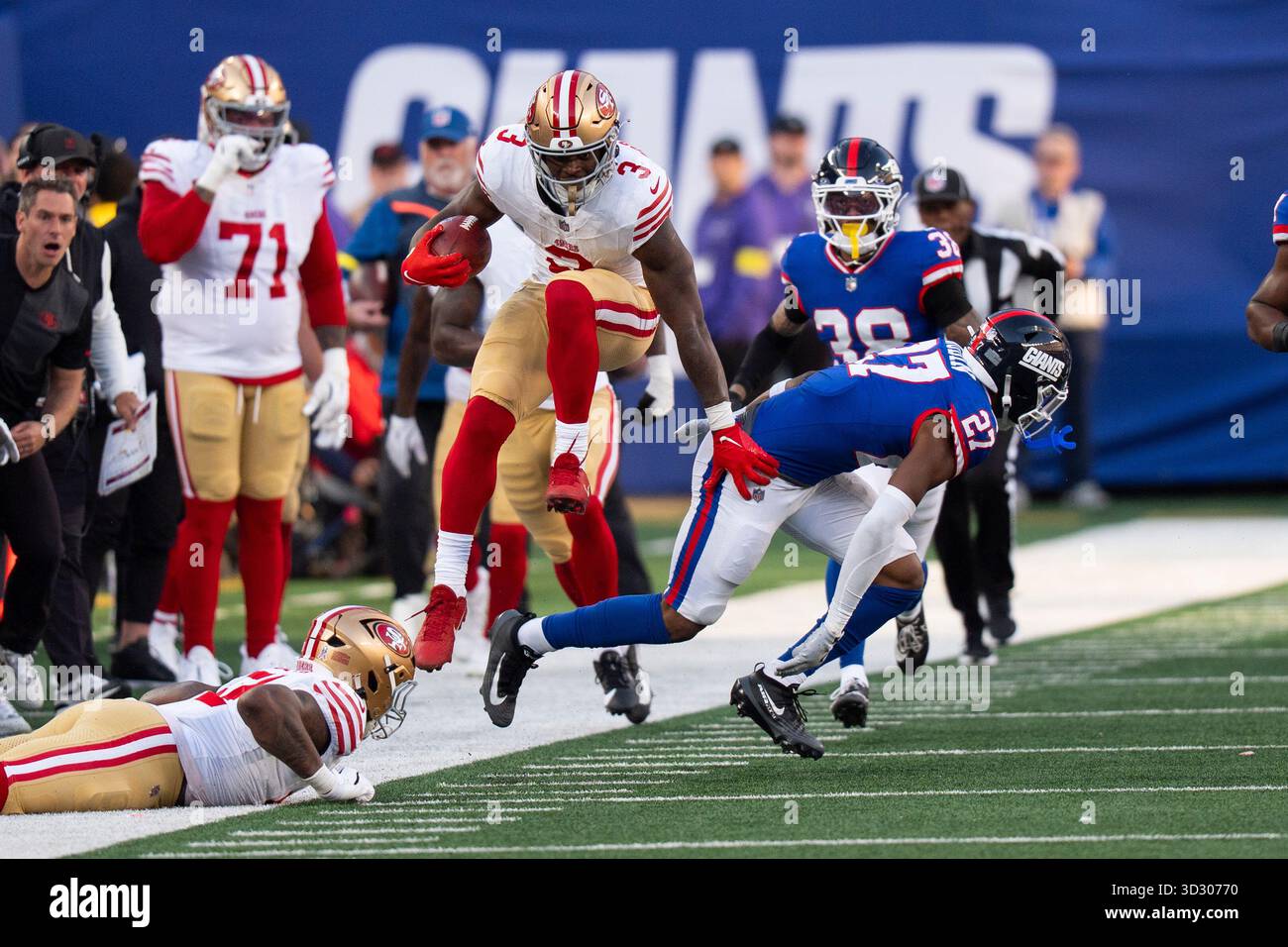 San Francisco 49ers running back Brian Robinson Jr. (3) leaps over New ...