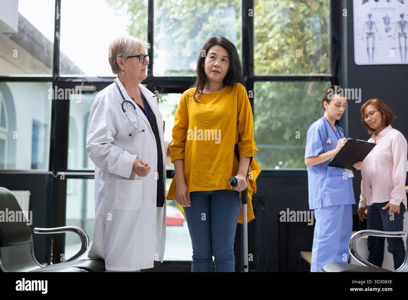 Doctor guiding patient with locomotor disability while using crutches ...