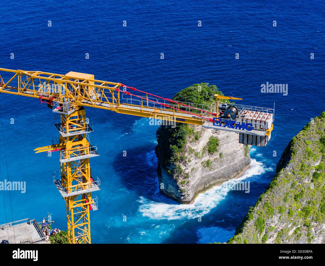 Large construction crane on the cliffs of the iconic T-Rex beach on ...