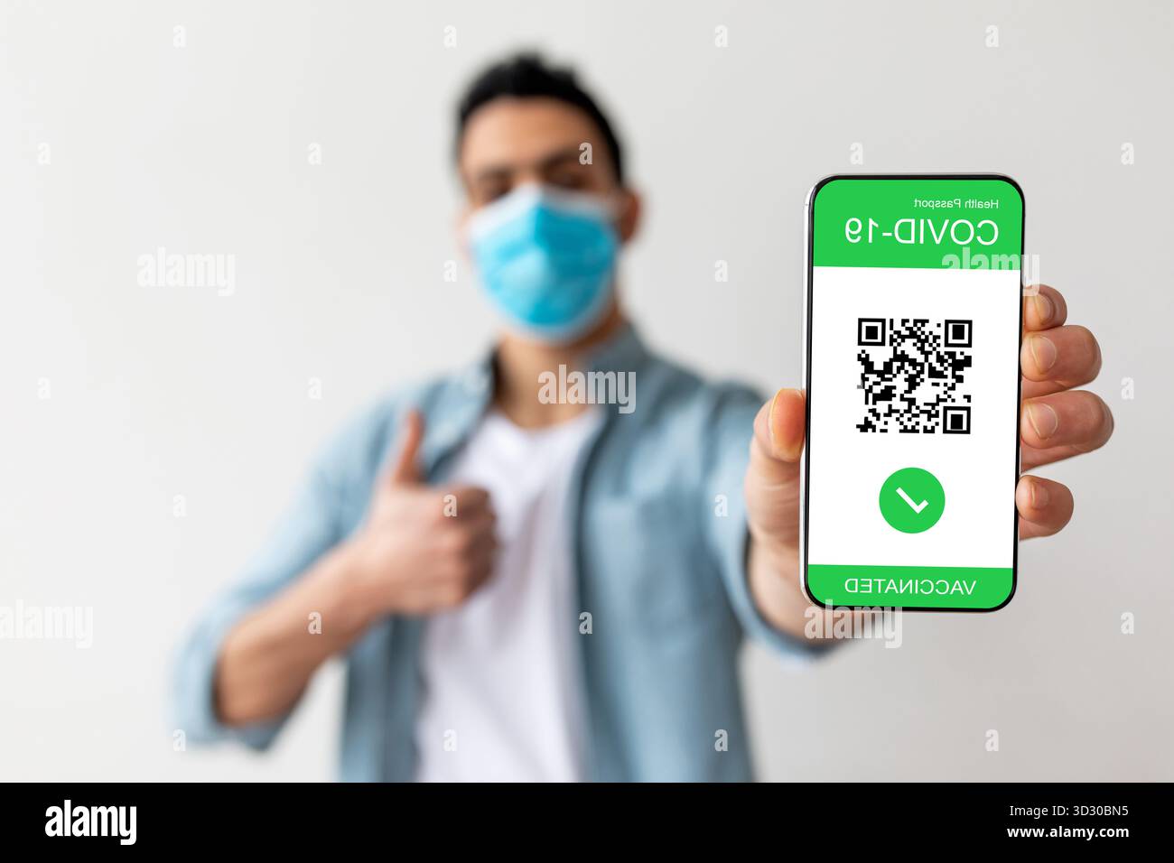 Person Holding a Smartphone Displaying COVID-19 Vaccination Status With ...
