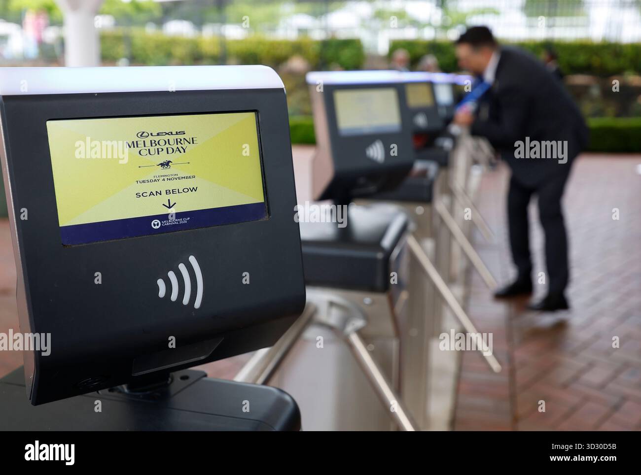 A ticket scanner at the gates of Flemington Racecourse on Melbourne Cup ...