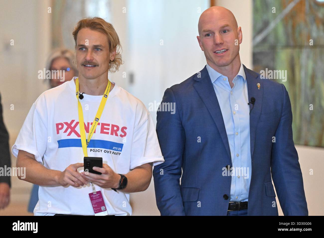 Podcaster Konrad Benjamin and Independent Senator David Pocock arrive ...