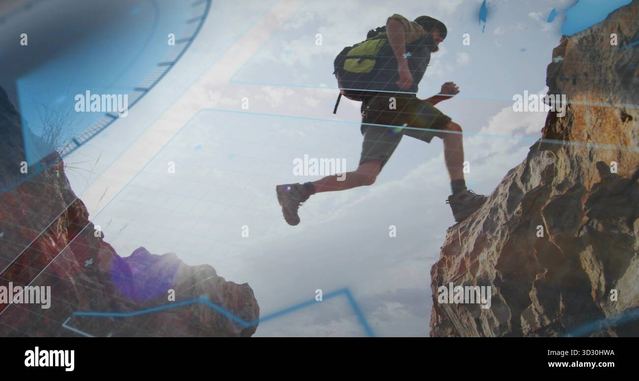 Leaping hiker wearing brimmed cap, boots and backpack over canyon gap ...
