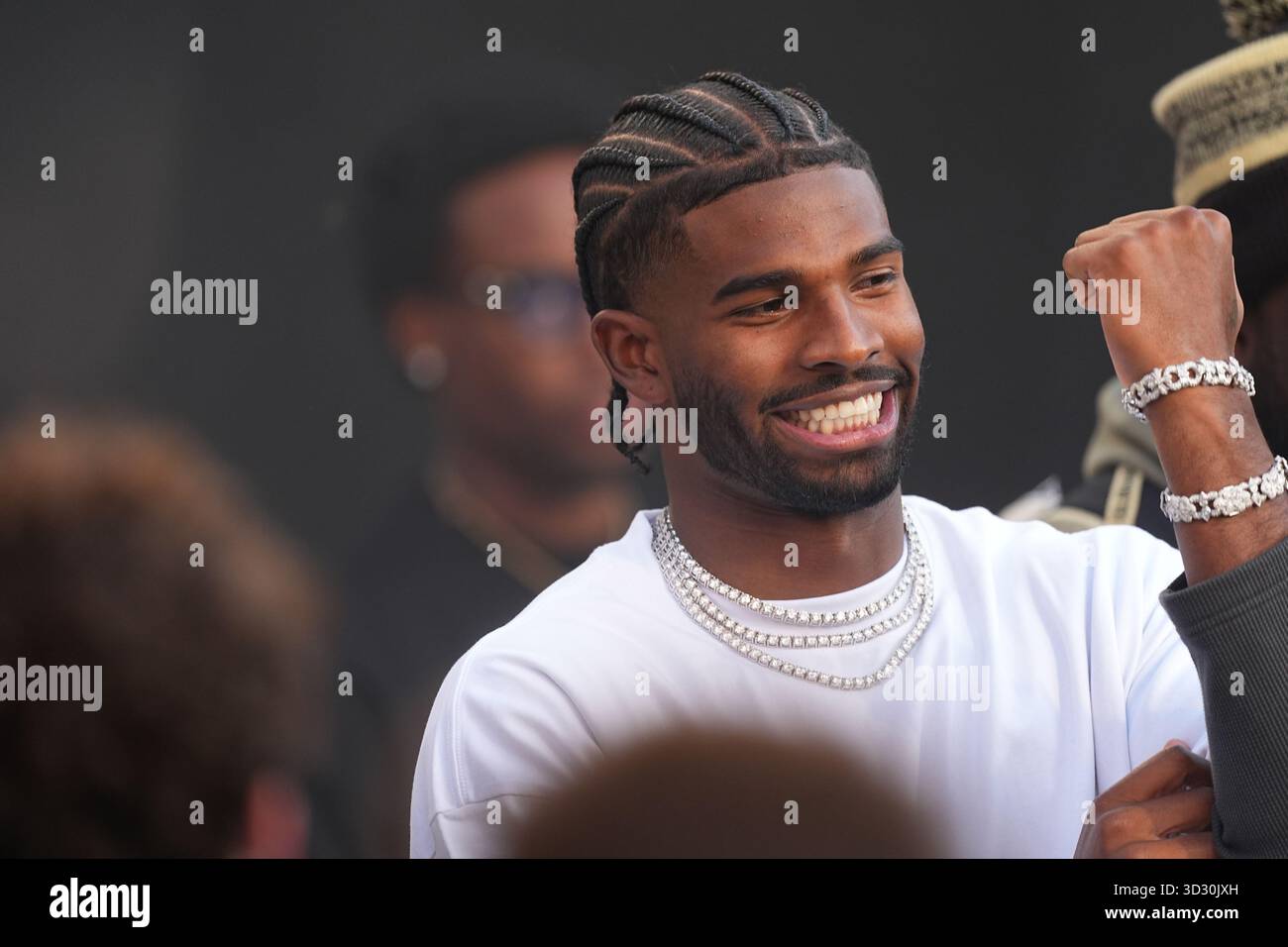 Cleveland Browns quarterback Shedeur Sanders gestures to fans as he ...