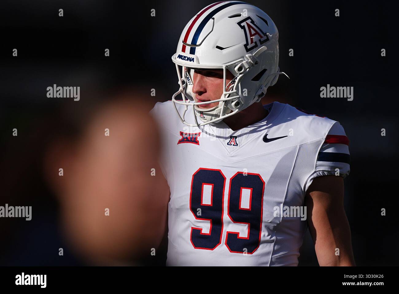 Arizona punter Isaac Lovison (99) warms up before an NCAA college ...