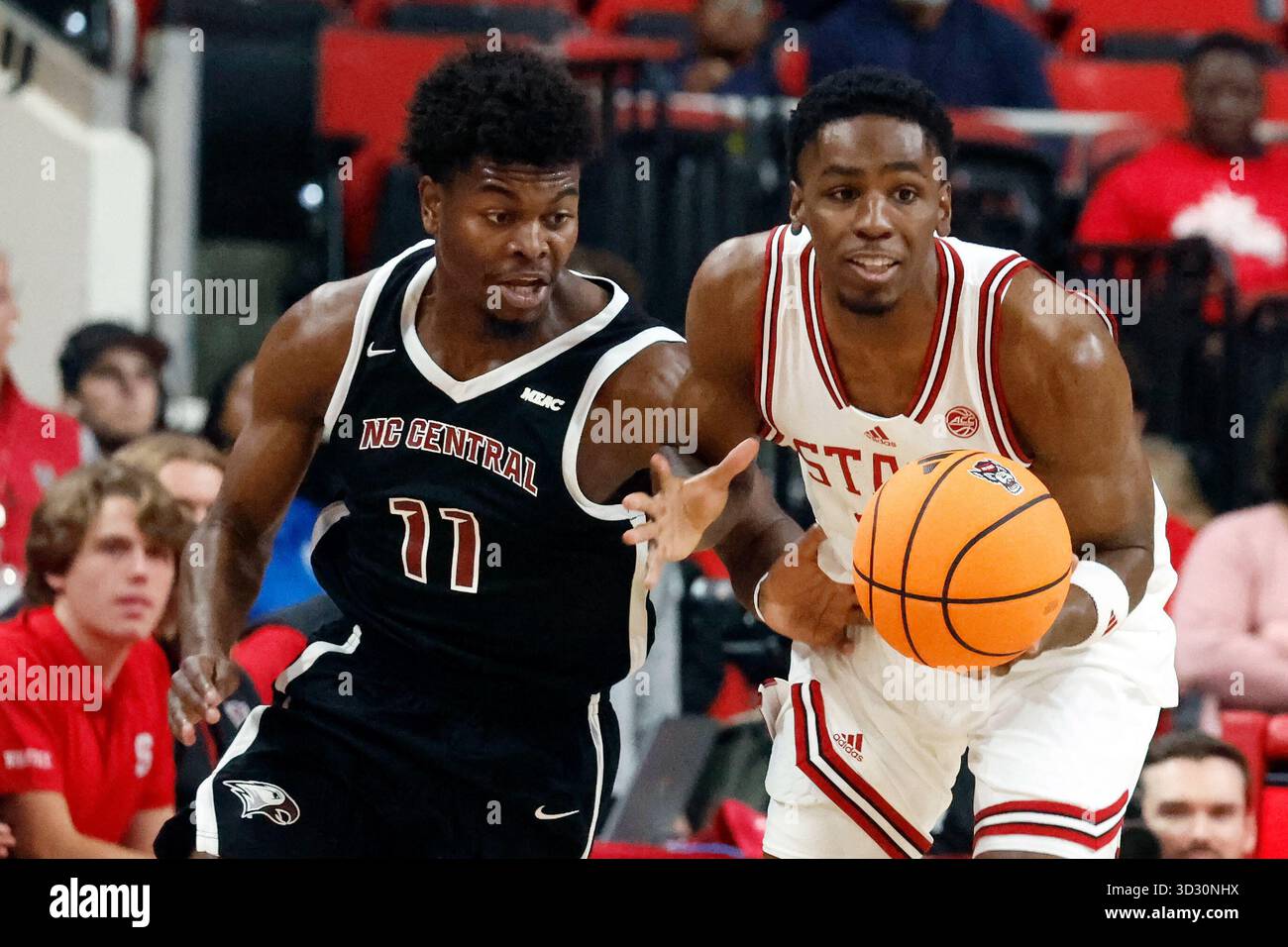 North Carolina State's Terrance Arceneaux, right, battles for the ball ...