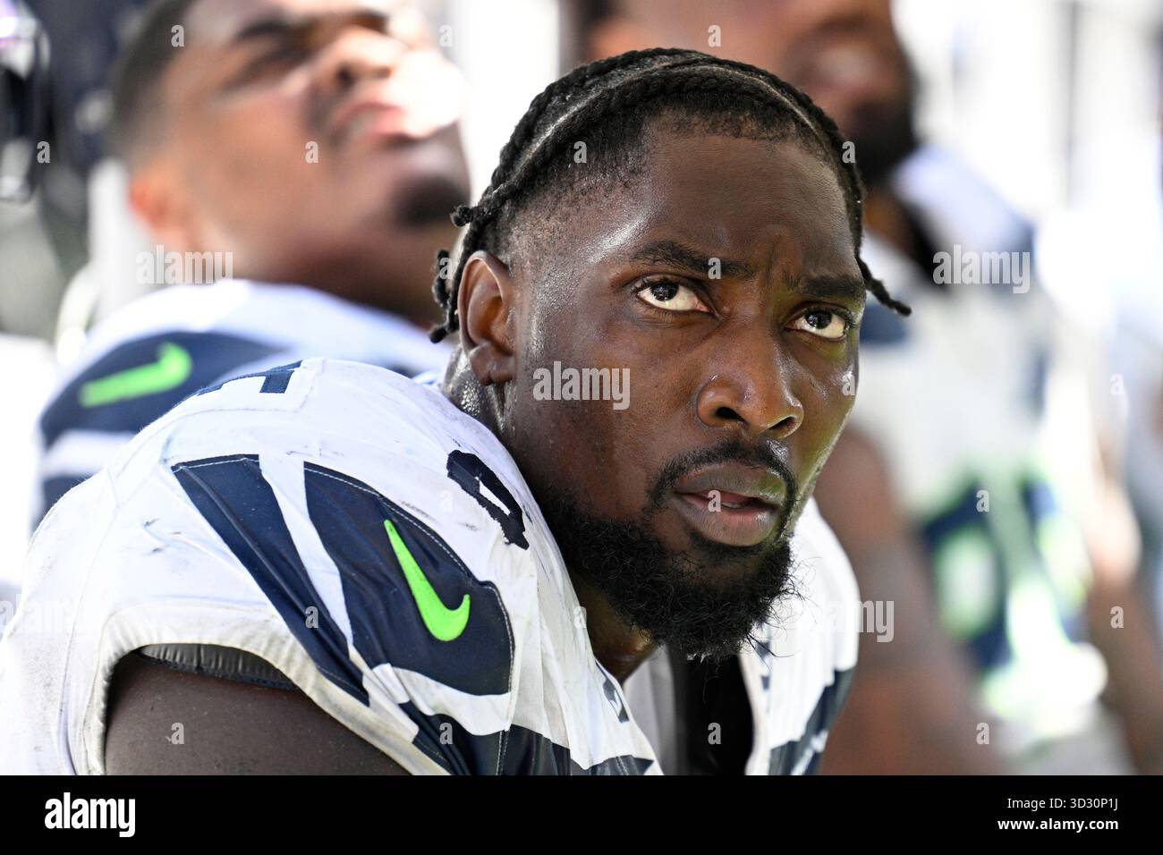 Seattle Seahawks linebacker DeMarcus Lawrence (0) looks on from the ...
