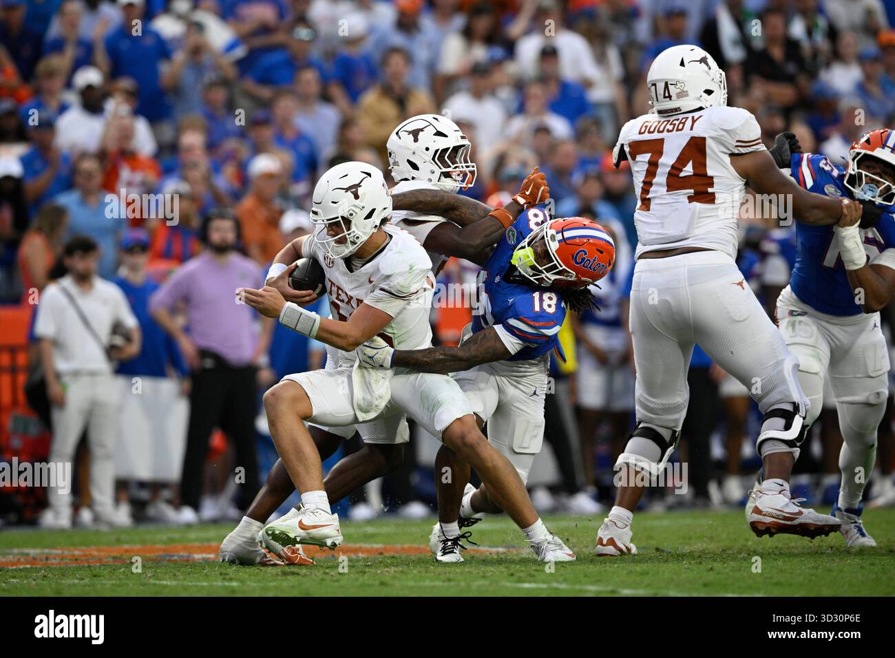 Texas quarterback Arch Manning (16) escapes from Florida defensive back Bryce Thornton (18 ...