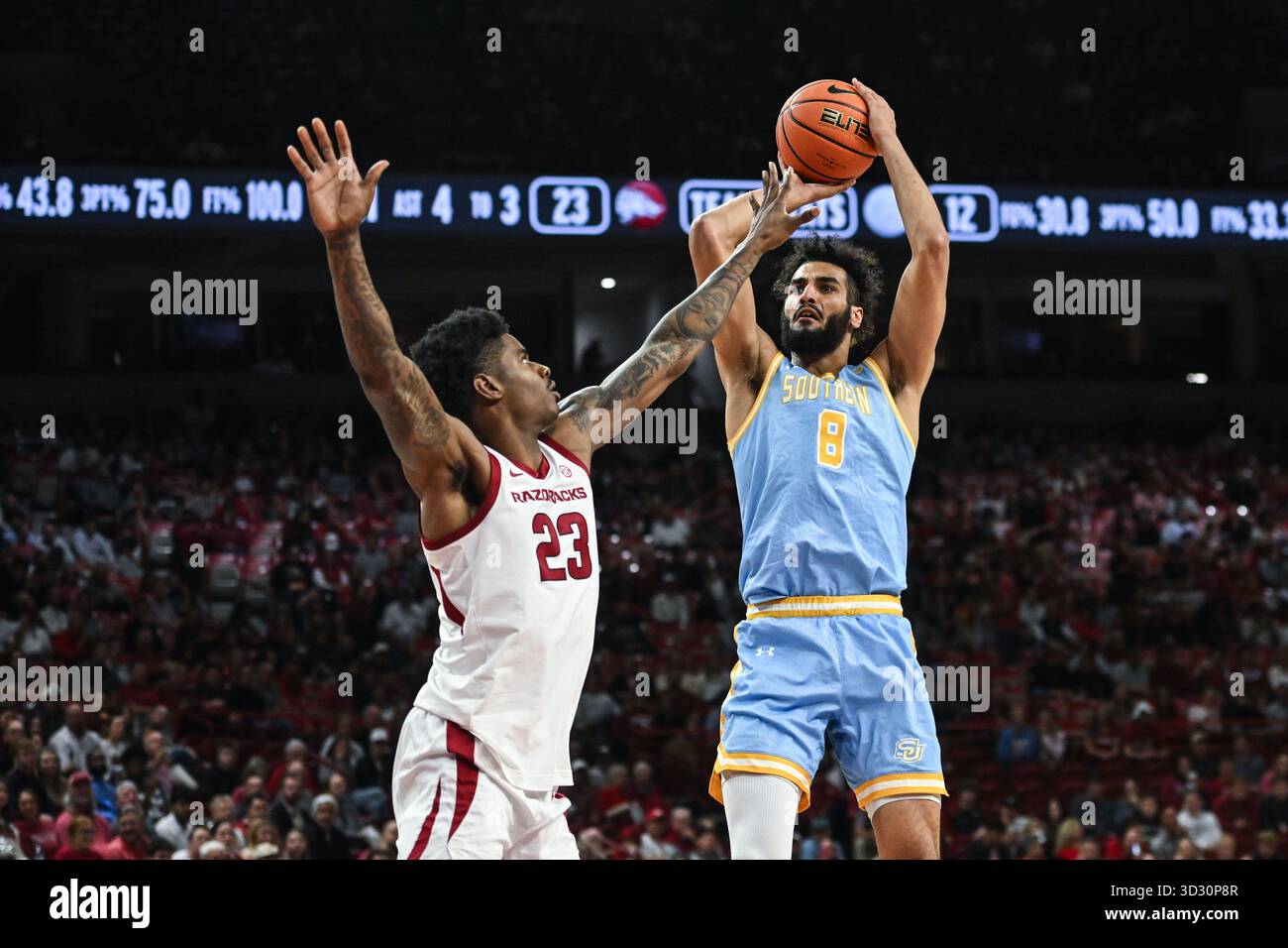 Southern forward Malek Abdelgowad (8) shoots over Arkansas forward Nick ...