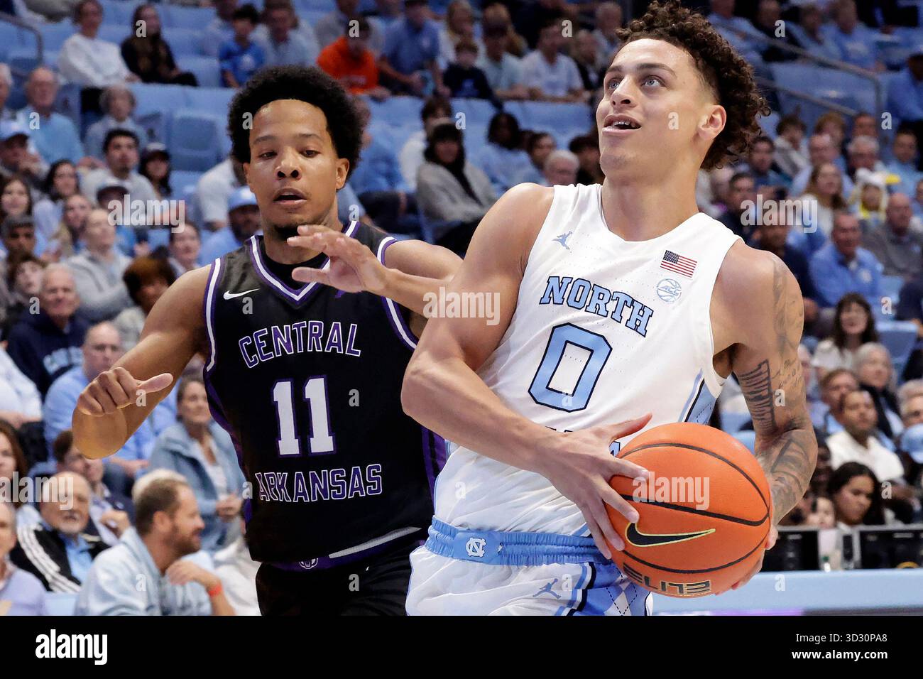 North Carolina guard Kyan Evans (0) drives against Central Arkansas ...