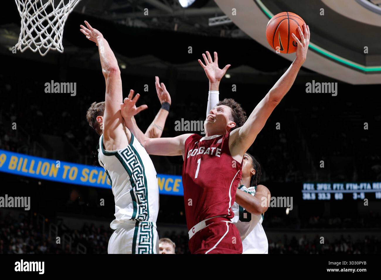 Colgate guard Brady Cummins (1) shoots against Michigan State center ...