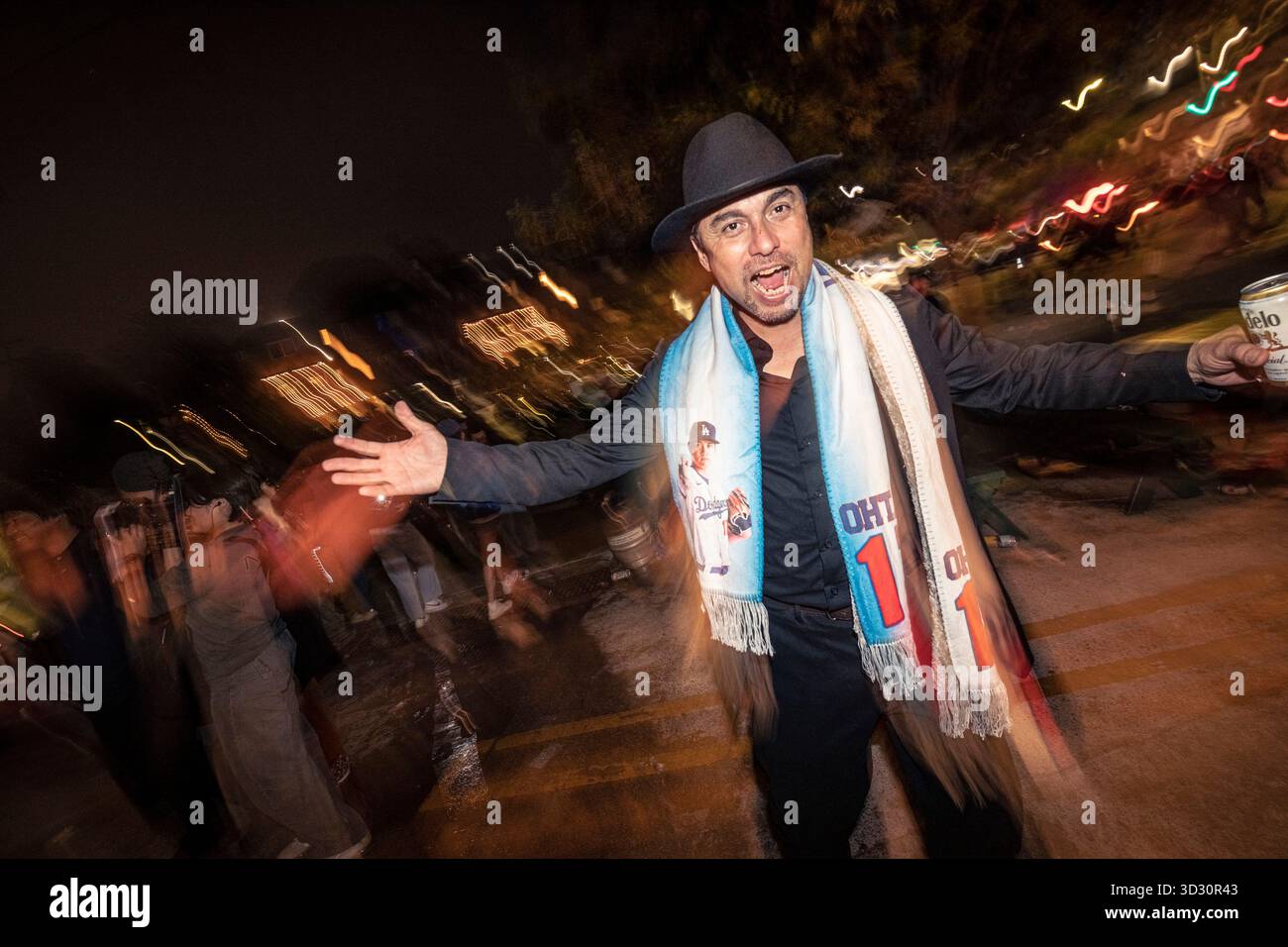 In Los Angeles, a fan cheers on the Dodgers. Police wait outside a bar ...