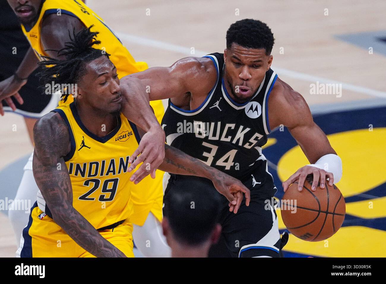 Milwaukee Bucks forward Giannis Antetokounmpo (34) is fouled by Indiana ...