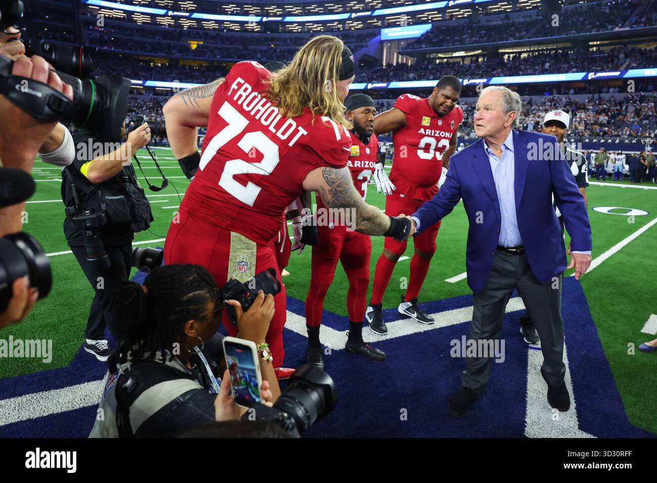 Arizona Cardinals guard Hjalte Froholdt (72) shakes hands with former ...